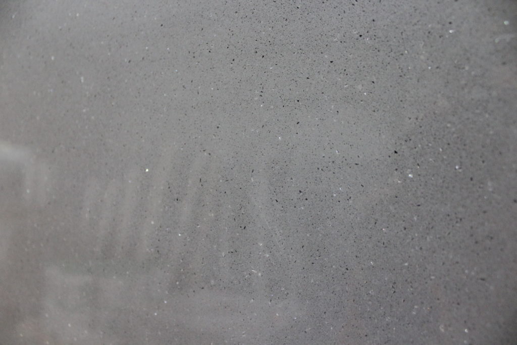 Sparkling Grey (close-up) - Hands on Granite